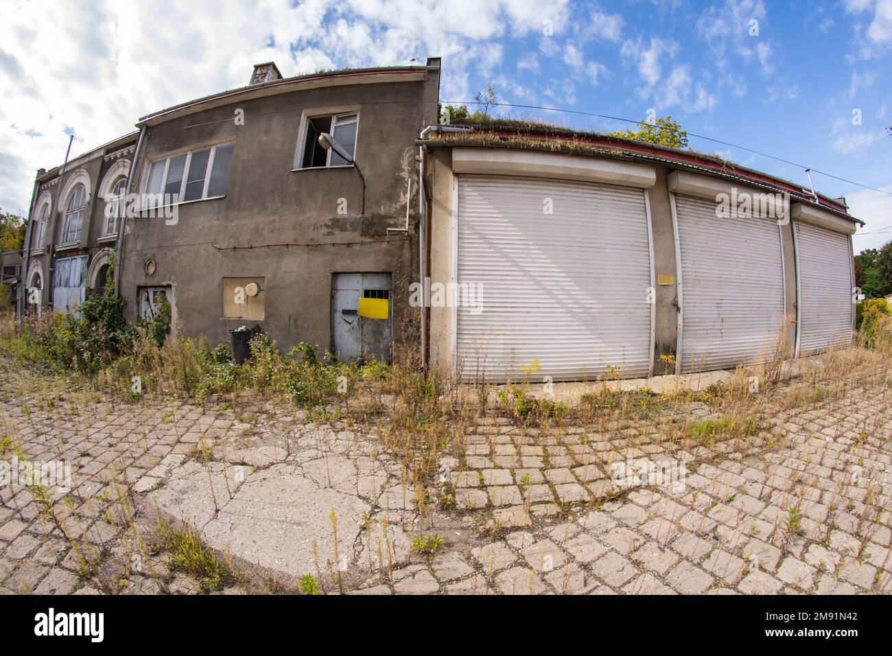 Abandoned and neglected building under a blue sky on a sunny day Stock ...