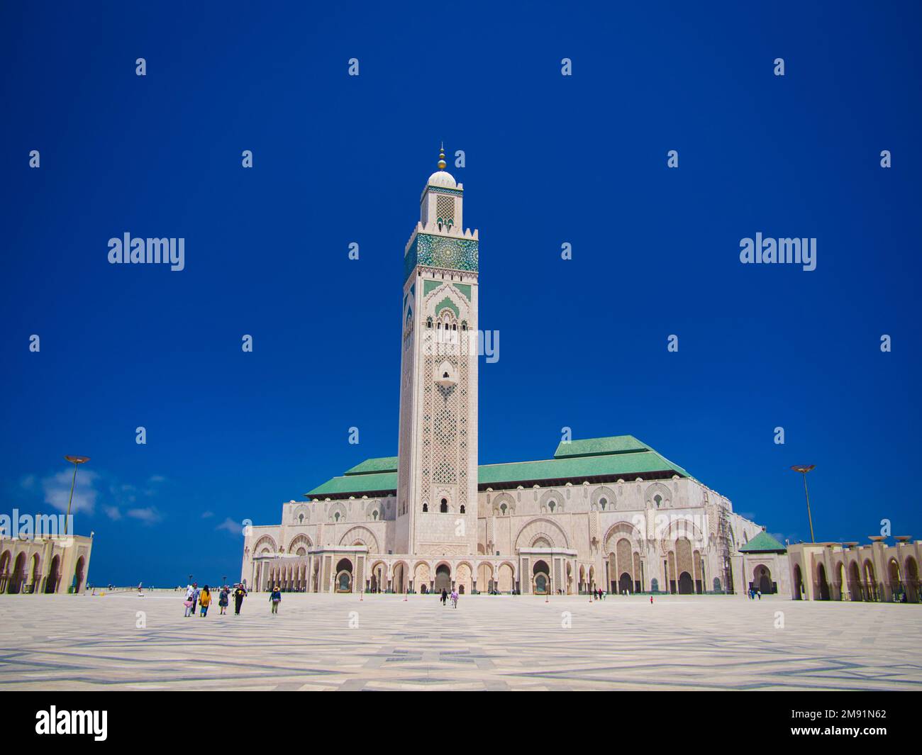 A tall minaret and huge arches decorates the Grand Hassan II Mosque ...