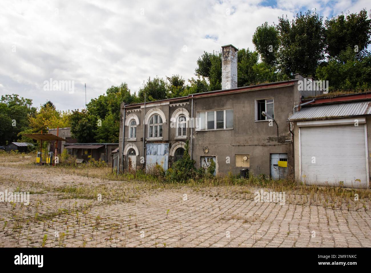 Abandoned and neglected building under a blue sky on a sunny day Stock ...