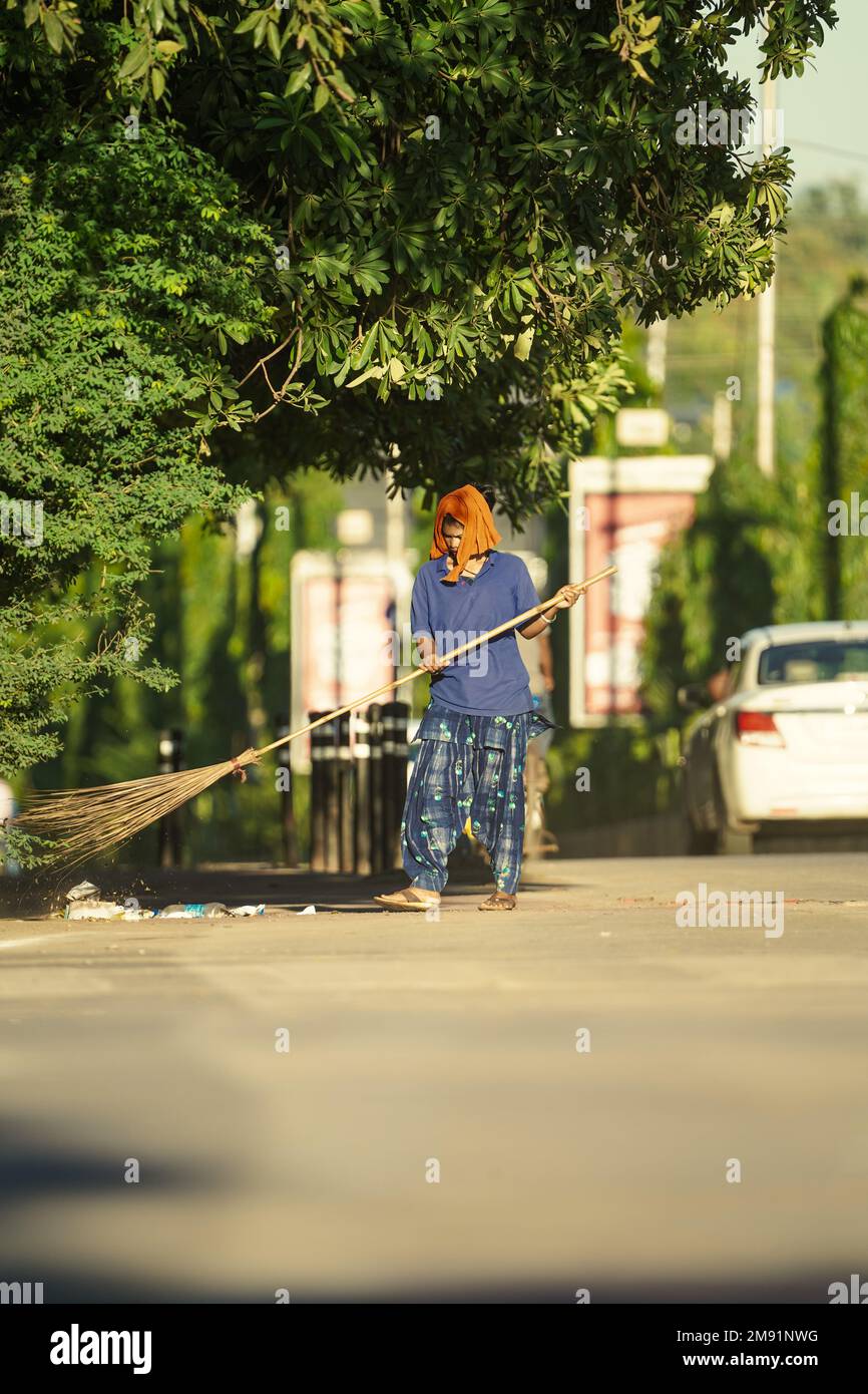Lady with broom hi-res stock photography and images - Alamy
