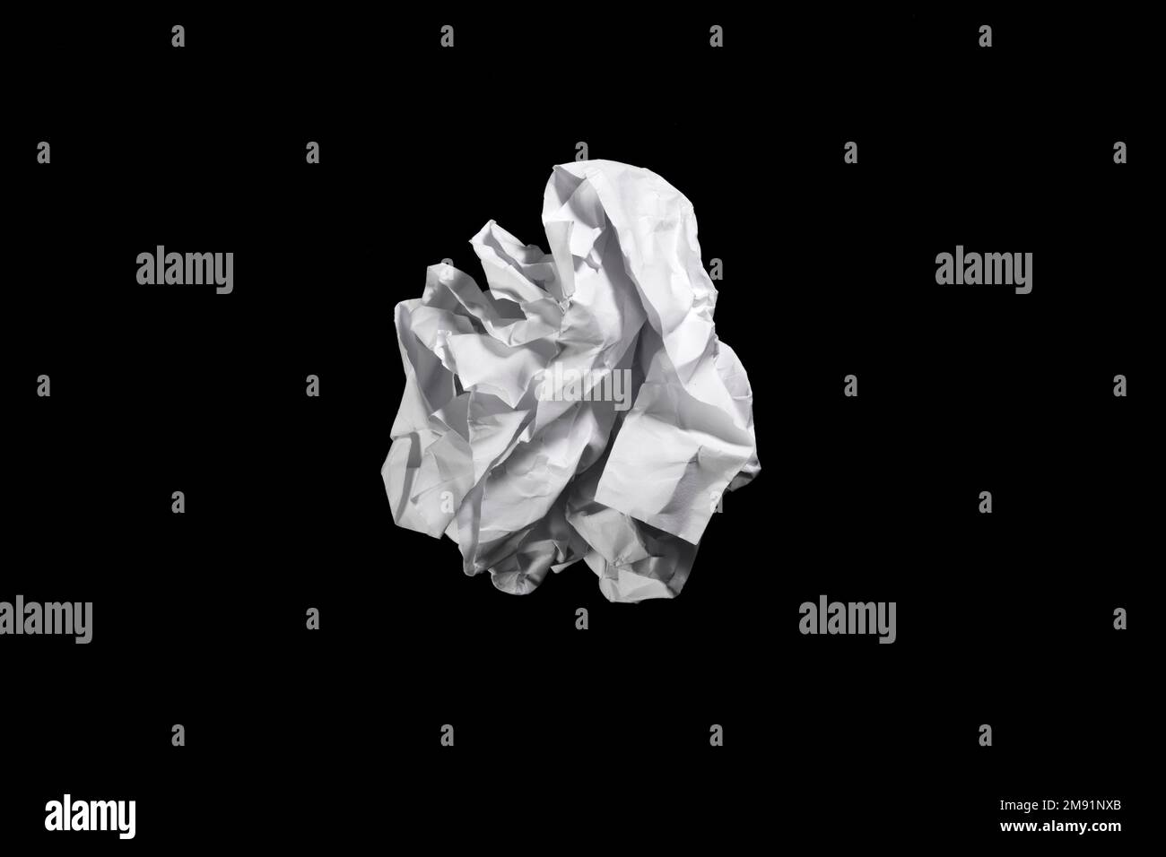 Crumpled paper ball isolated on a black background Stock Photo - Alamy