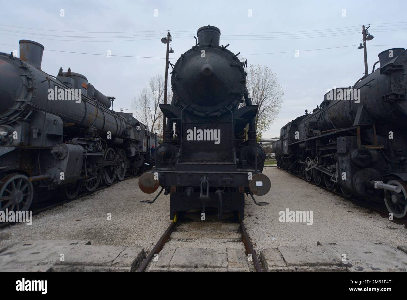 Antique steam locomotives displayed around a loco turntable, at the ...