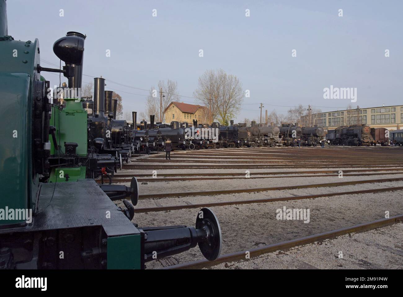 Antique steam locomotives displayed around a loco turntable, at the ...