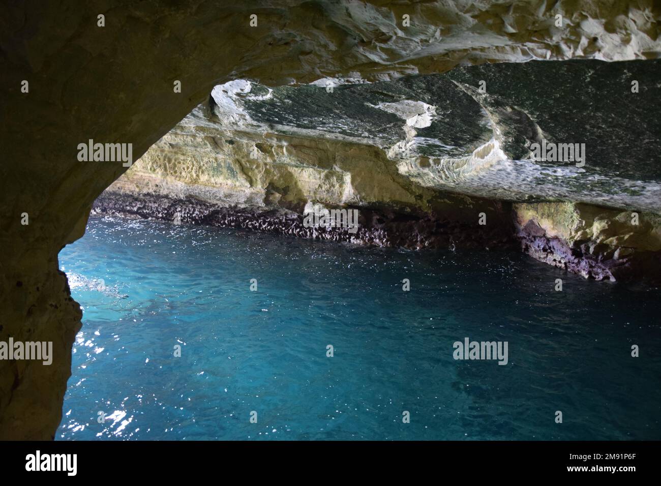 Rosh HaNikra Grottoes with white chalk cliffs and cable car in Israel ...