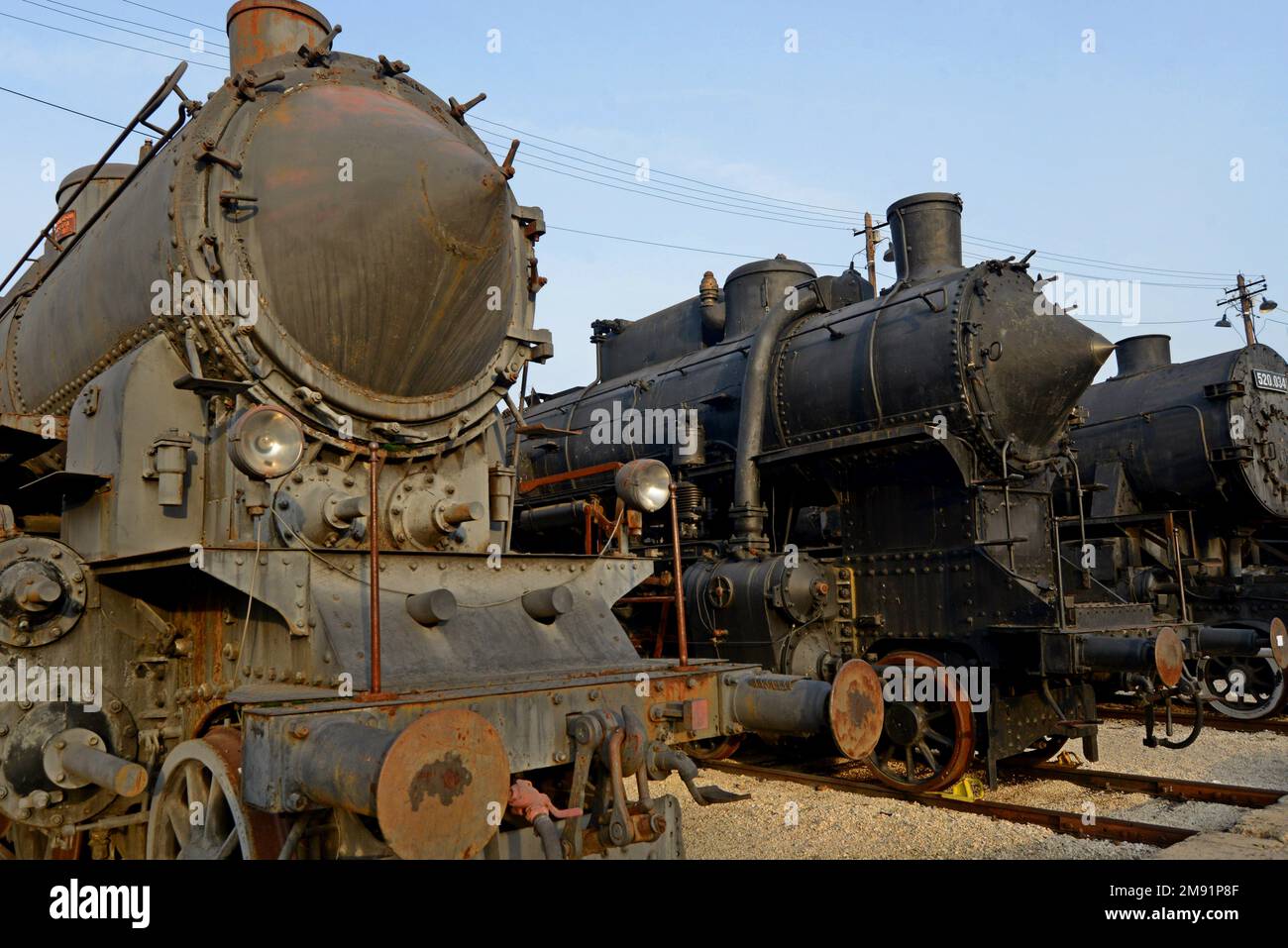 Antique steam locomotives displayed around a loco turntable, at the ...