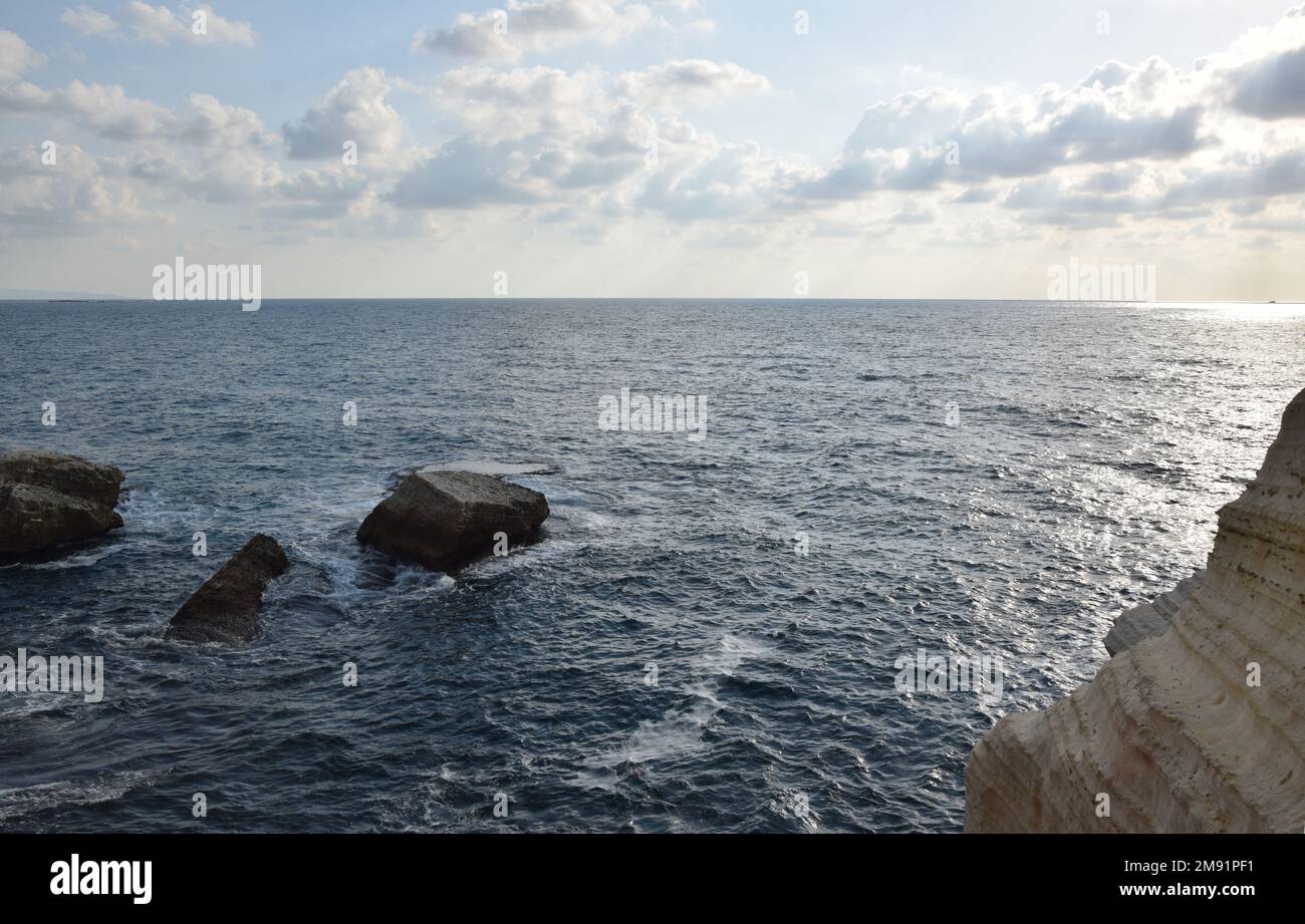 Rosh HaNikra Grottoes with white chalk cliffs and cable car in Israel ...