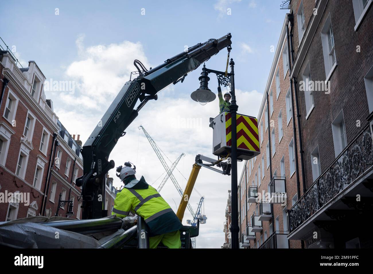 Street lighting technicians with the contractor, Conway, change street ...