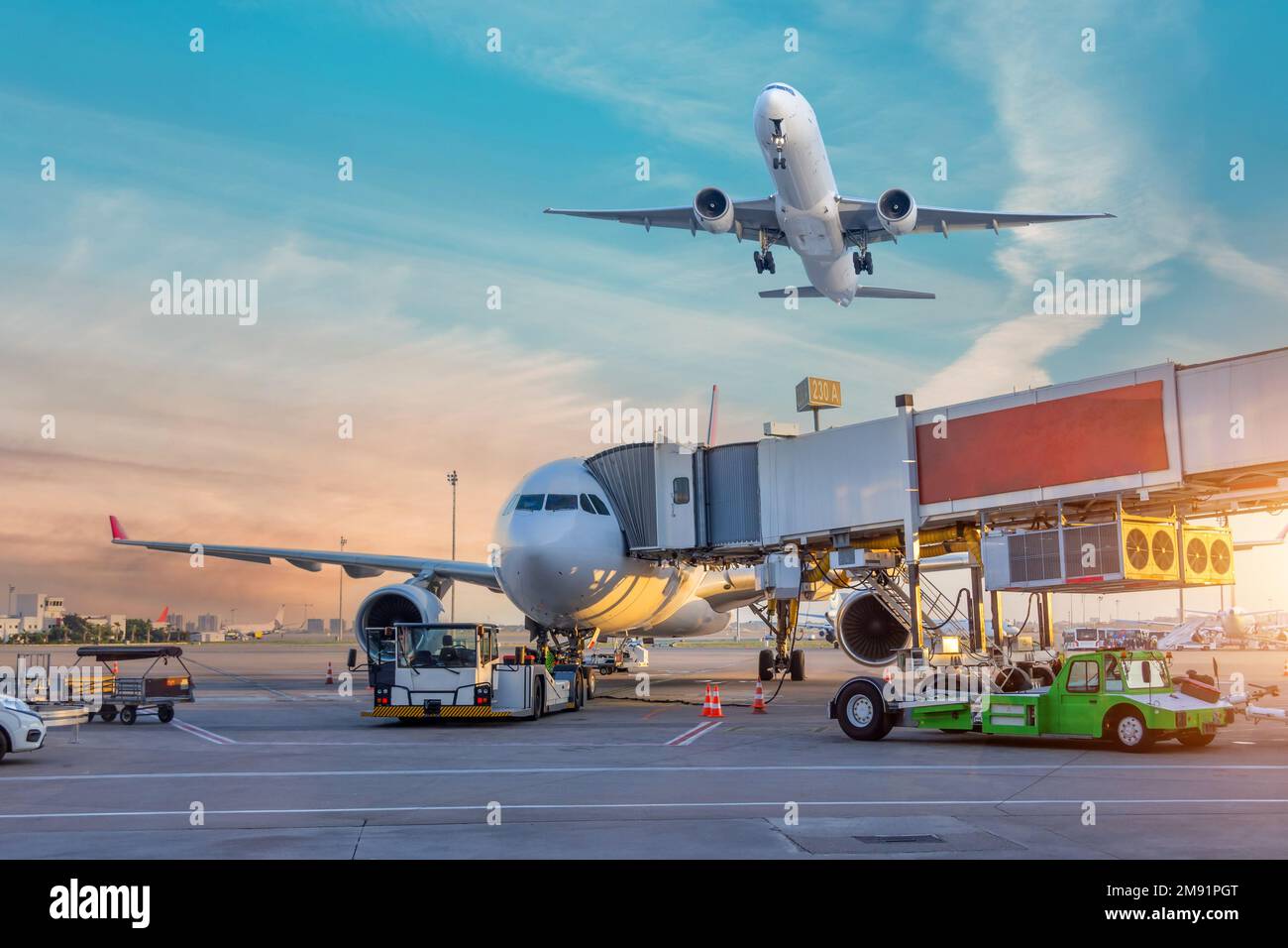 Aircraft is attached to the terminal gangway of the airport building ...