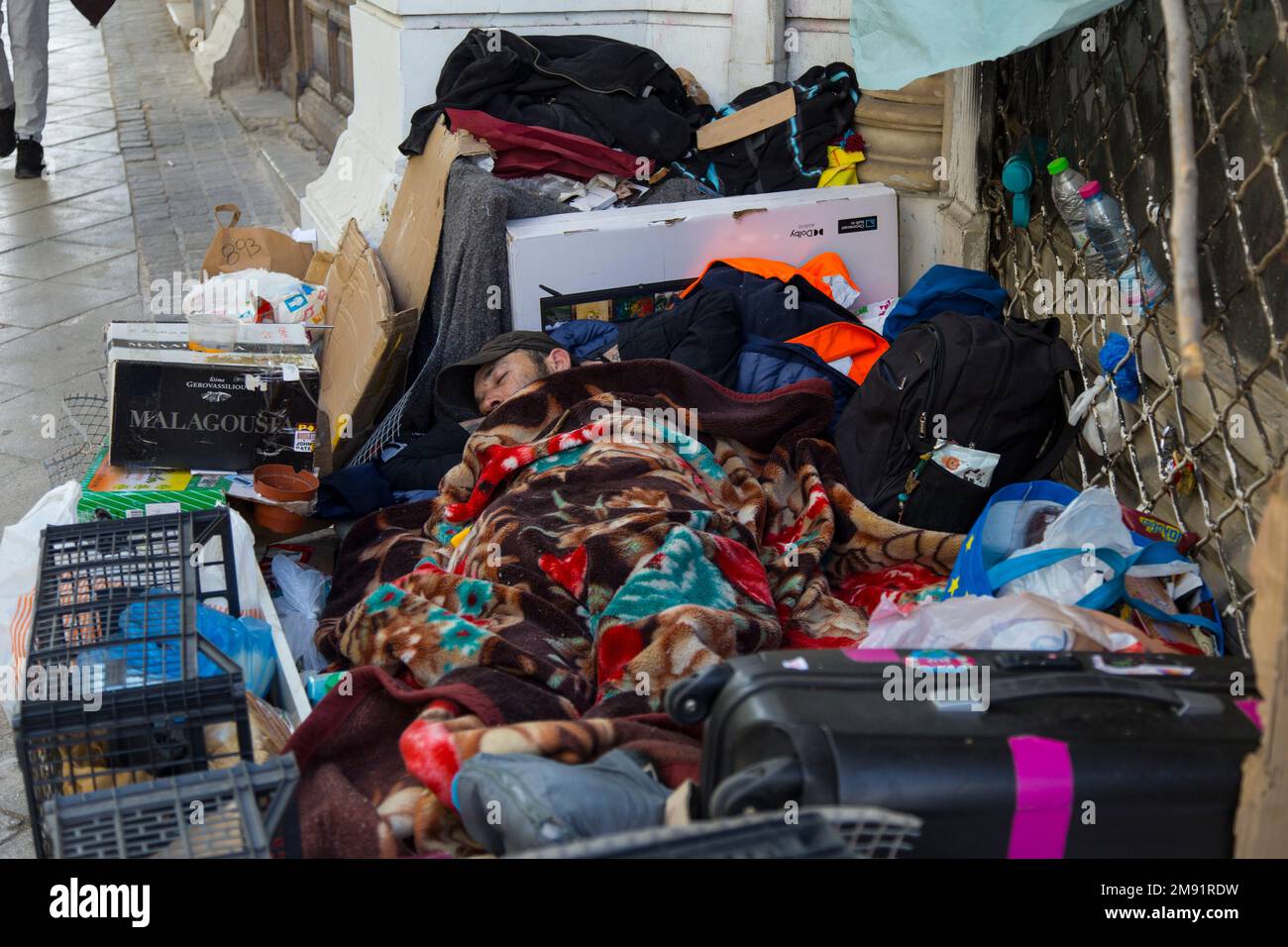 Homeless man refugee sleeping hi-res stock photography and images - Alamy