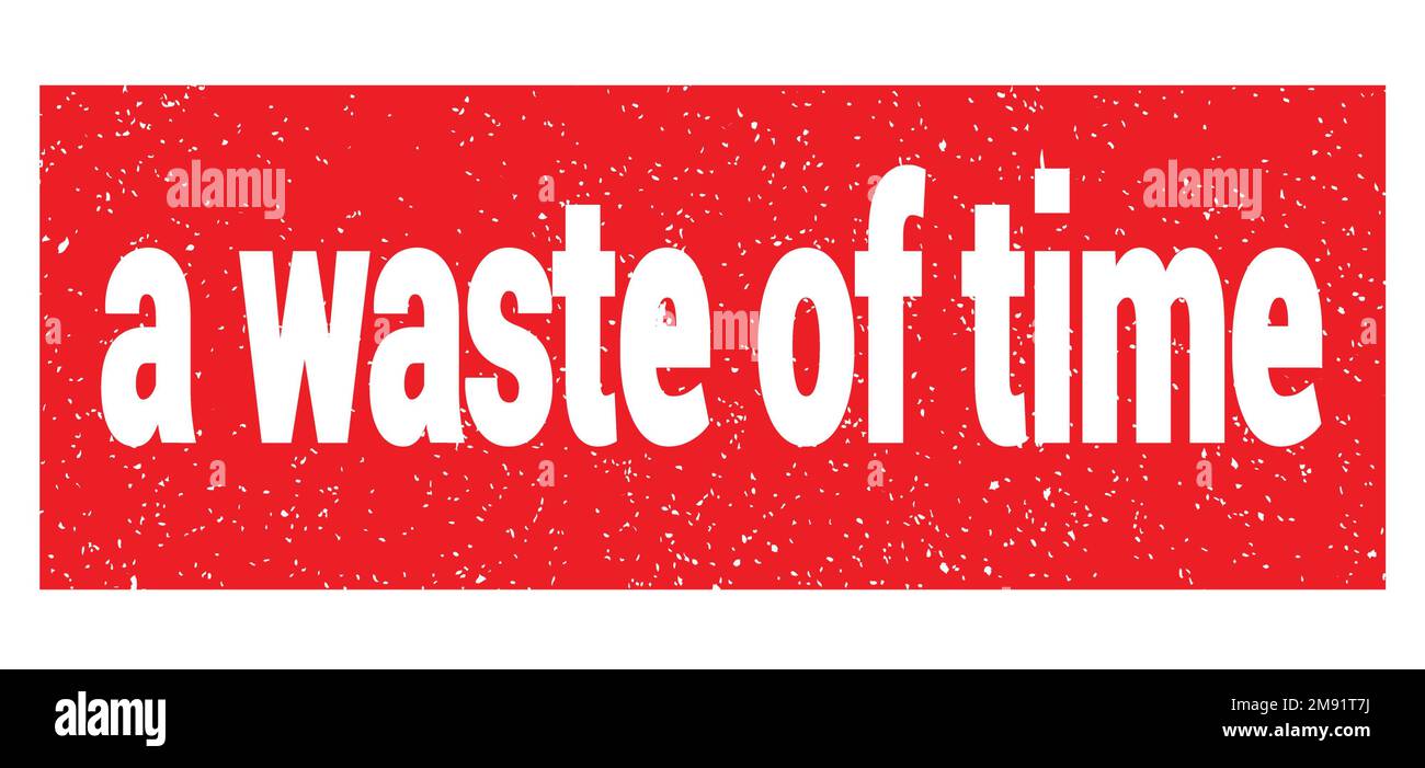 a waste of time text written on red grungy stamp sign Stock Photo - Alamy
