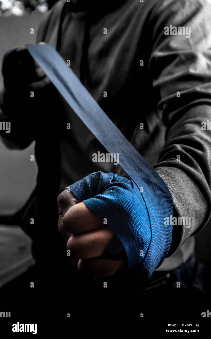 A closeup of a male hand wrapping the other hand for boxing Stock Photo ...