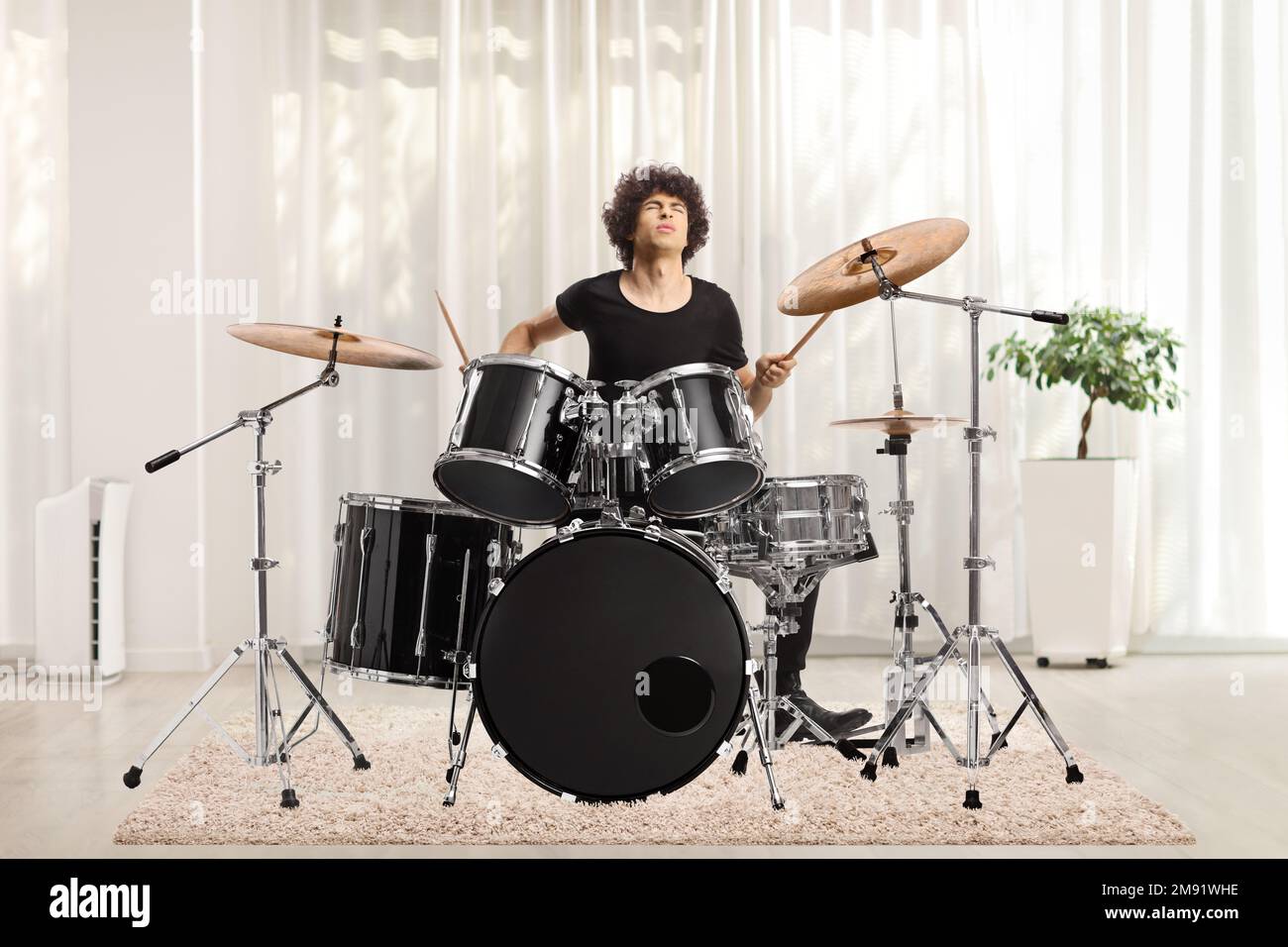 Cheerful guy playing drums hi-res stock photography and images - Alamy