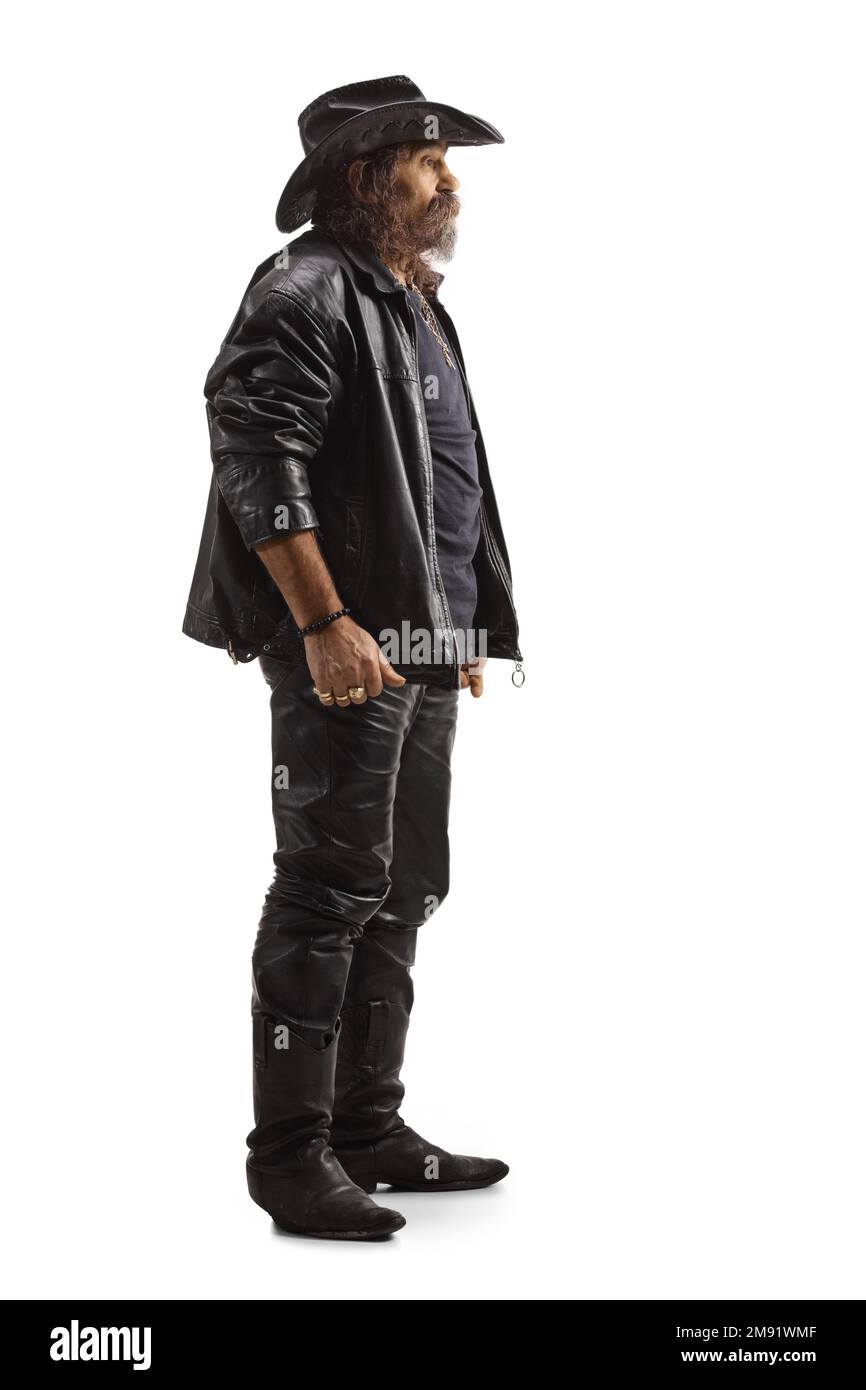 Full length profile shot of a man in leather clothes and a black cowboy ...
