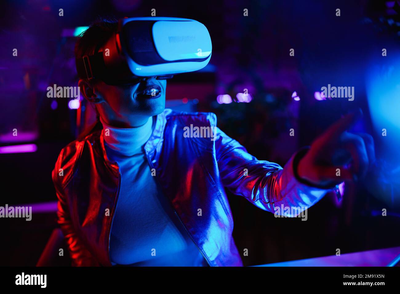 Neon metaverse futuristic concept. elegant middle aged woman in virtual ...