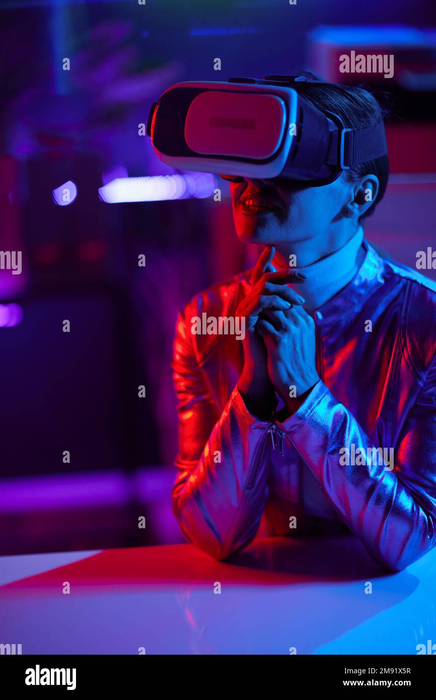 Neon metaverse futuristic concept. happy trendy female in vr headset ...