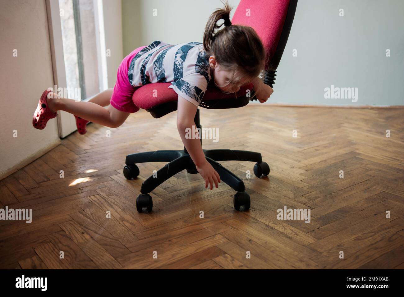 Spinning on chair hi-res stock photography and images - Alamy