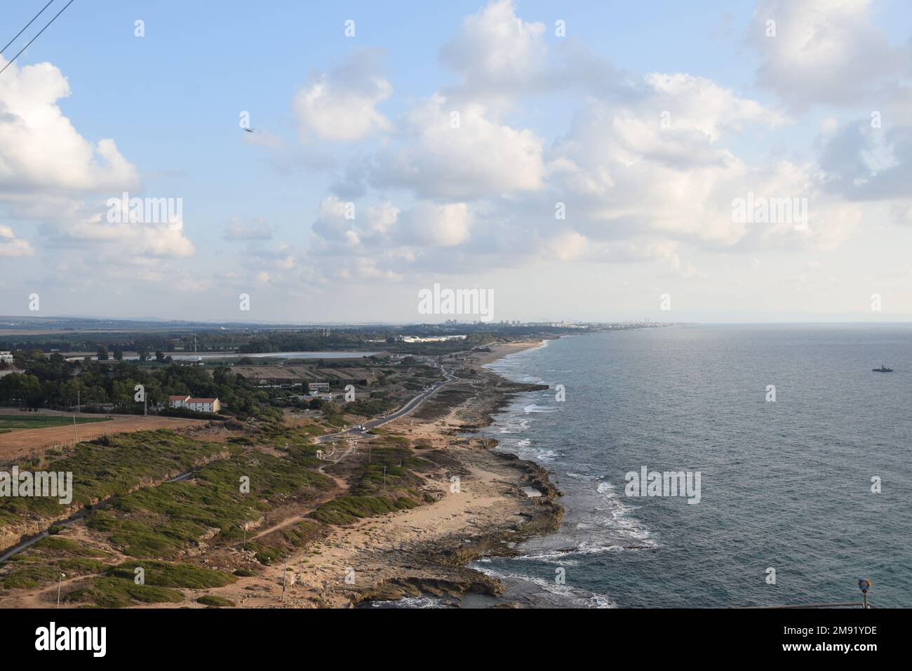 Rosh HaNikra Grottoes with white chalk cliffs and cable car in Israel ...