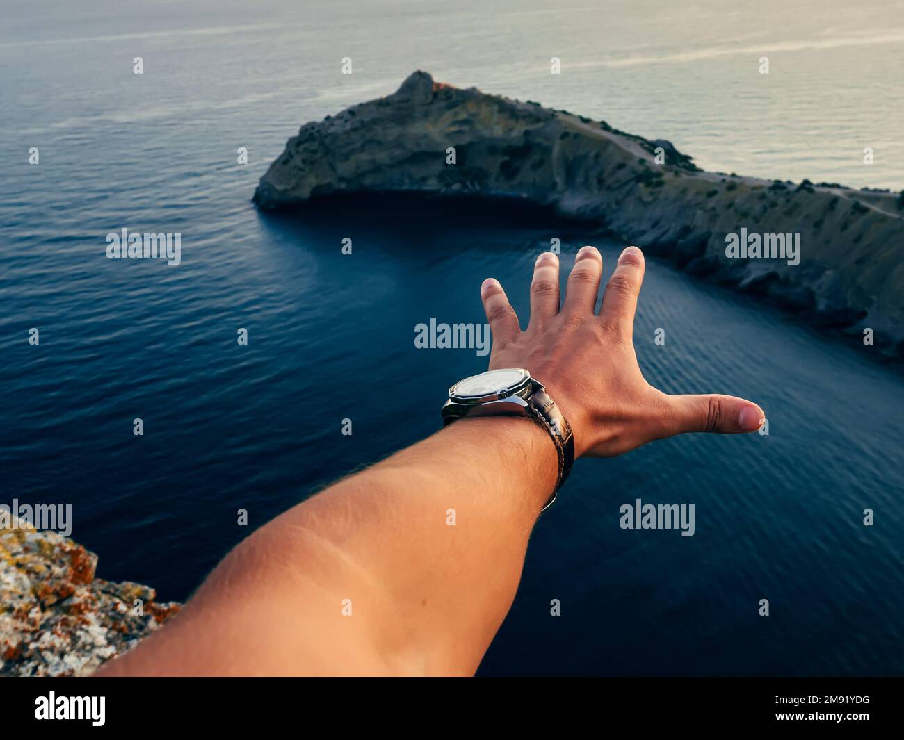 hand clock men against the sea on the nature of the tourist traveler ...