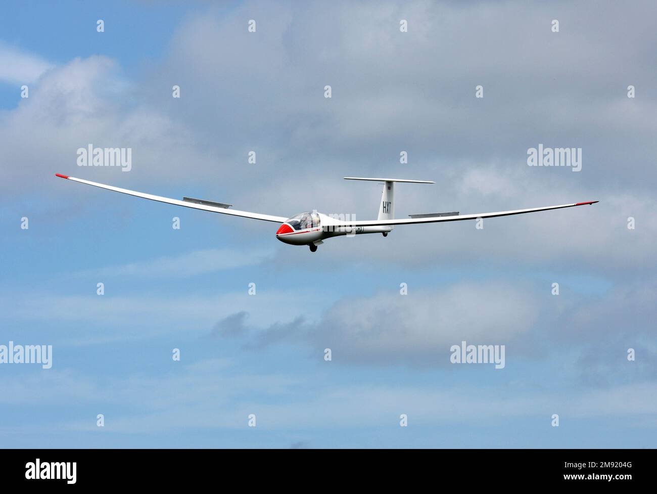 A Rolladen-Schneider LS-4a glider approaching a private airfield in ...