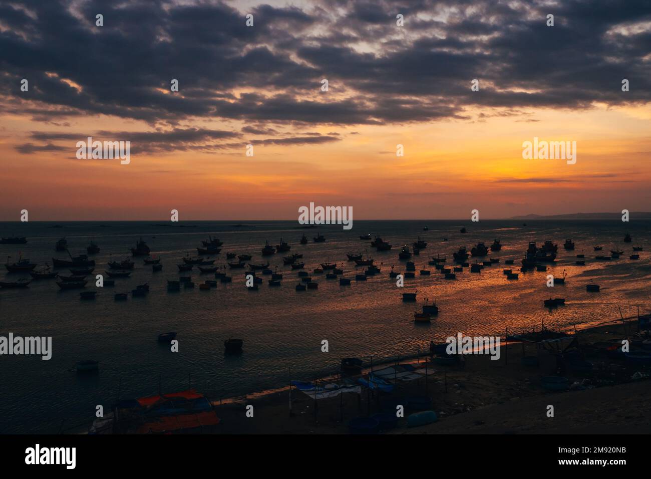 boats for sea fishing in Vietnam in Mui Ne on the background of sunset ...