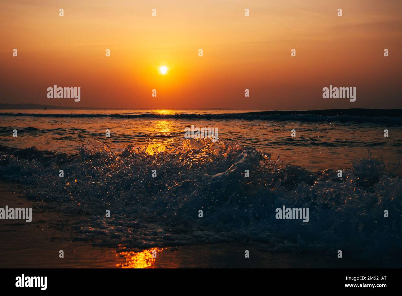 Splashing ocean waves beautiful sunset hi-res stock photography and ...
