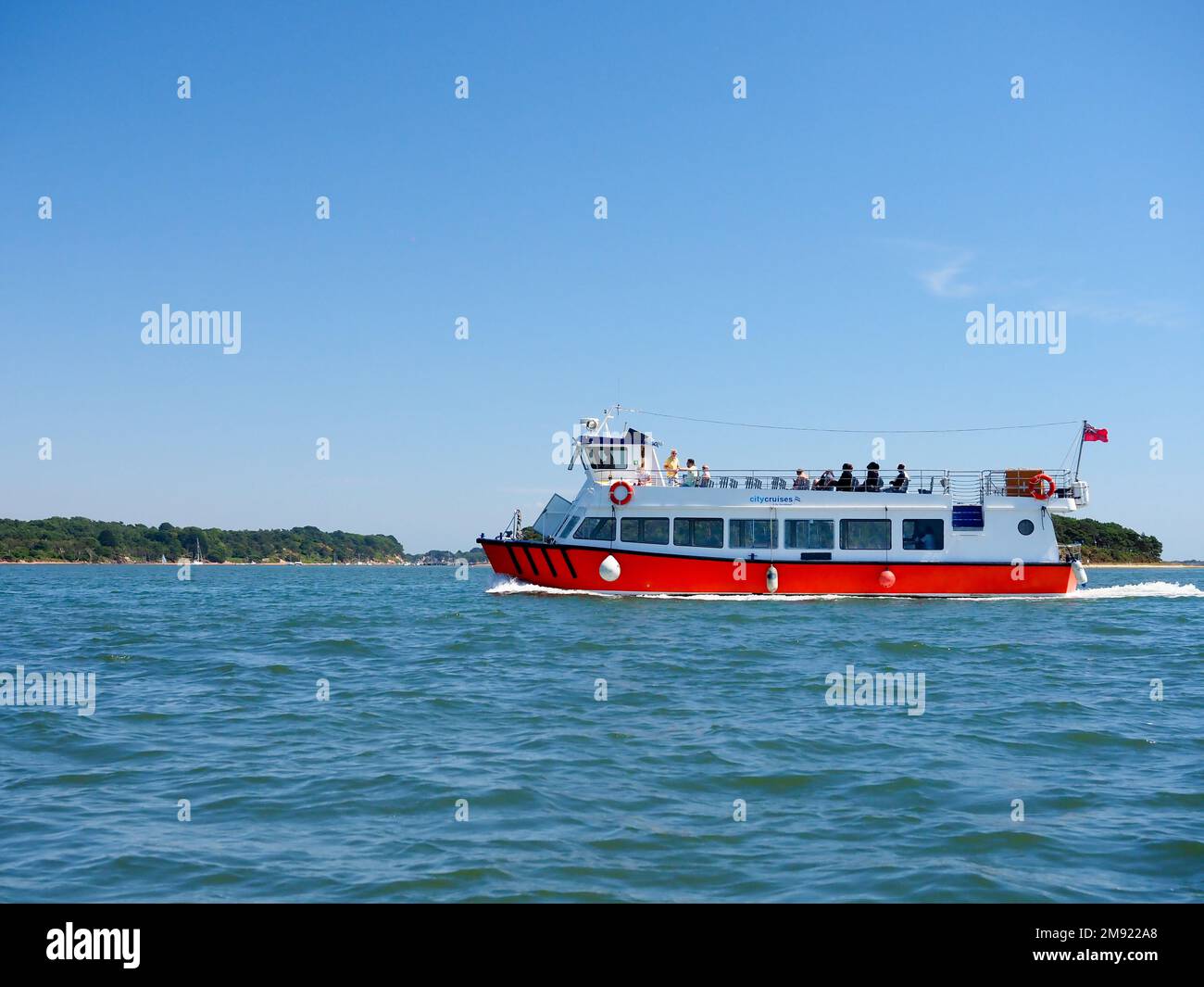 A tourist trip motorboat belonging to city cruises sailing in Poole ...