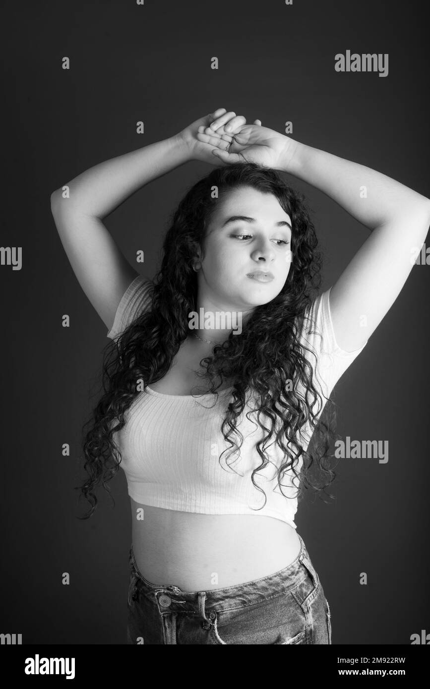 Black and white portrait of cheerful beautiful young woman with hands ...