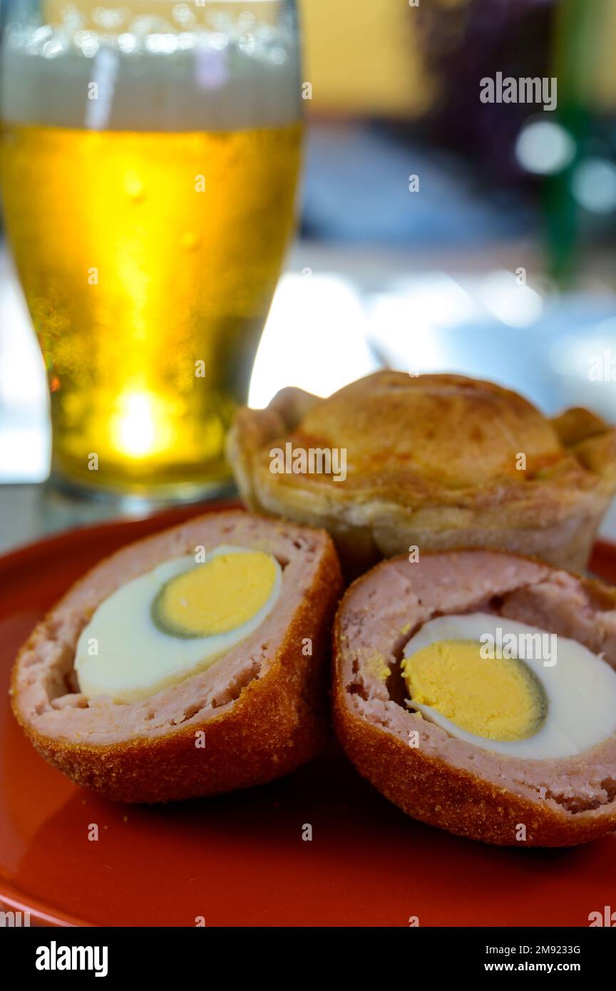 Traditional street food in UK, glass of lager beer, stuffed fried ...