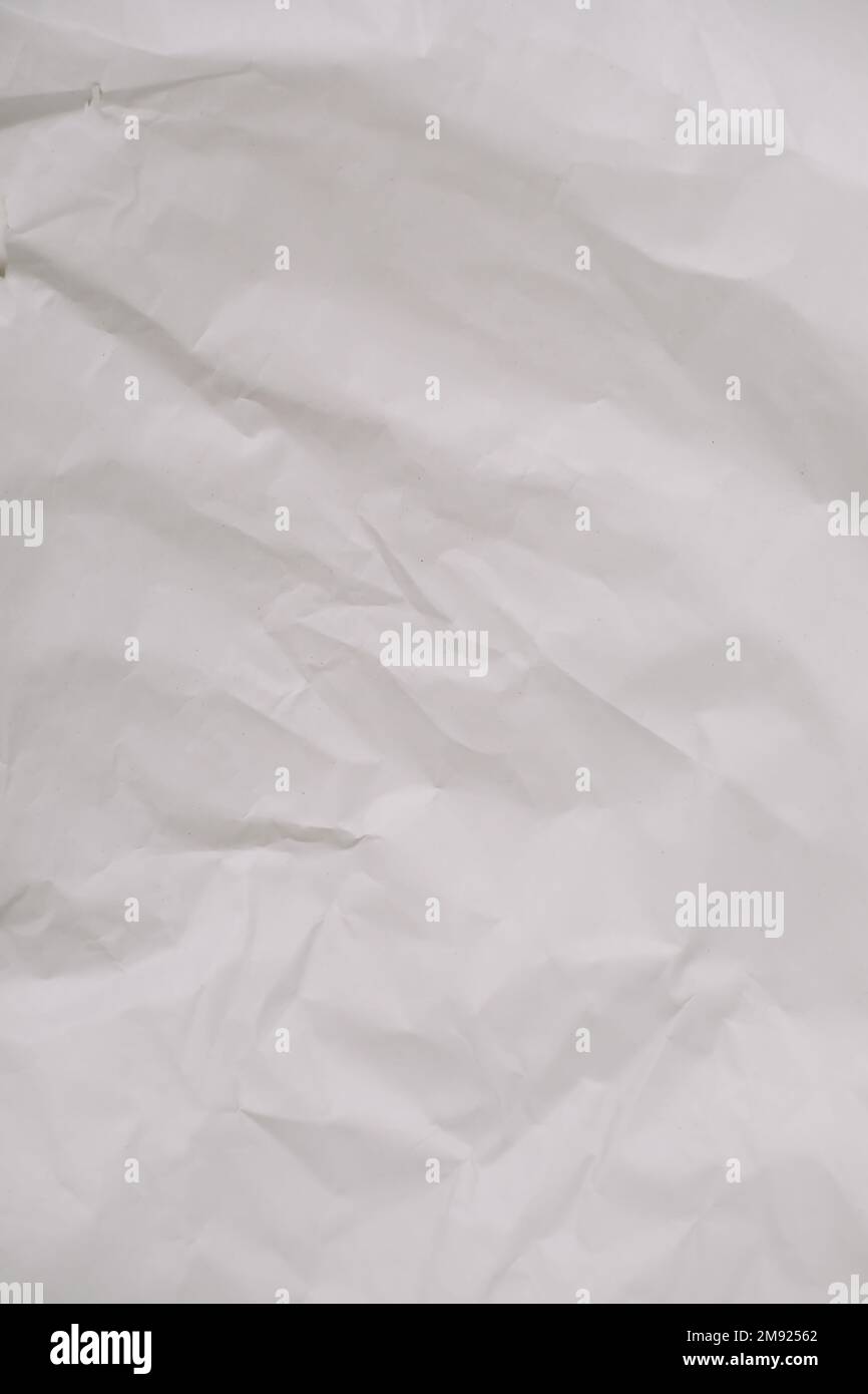 Recycled crumpled white paper texture background for design with copy ...