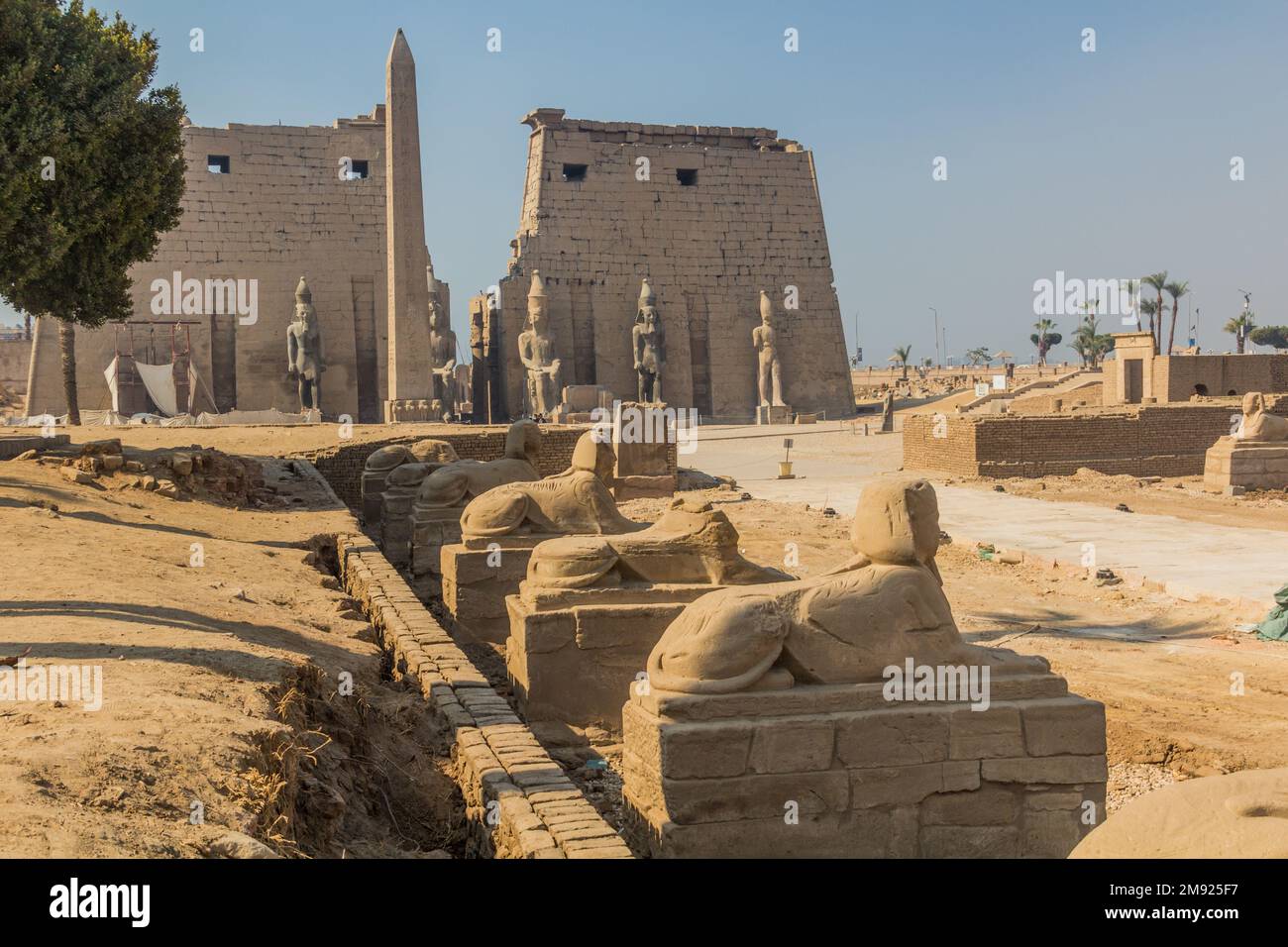 Luxor temple pylon and the Avenue of Sphinxes in Luxor, Egypt Stock ...
