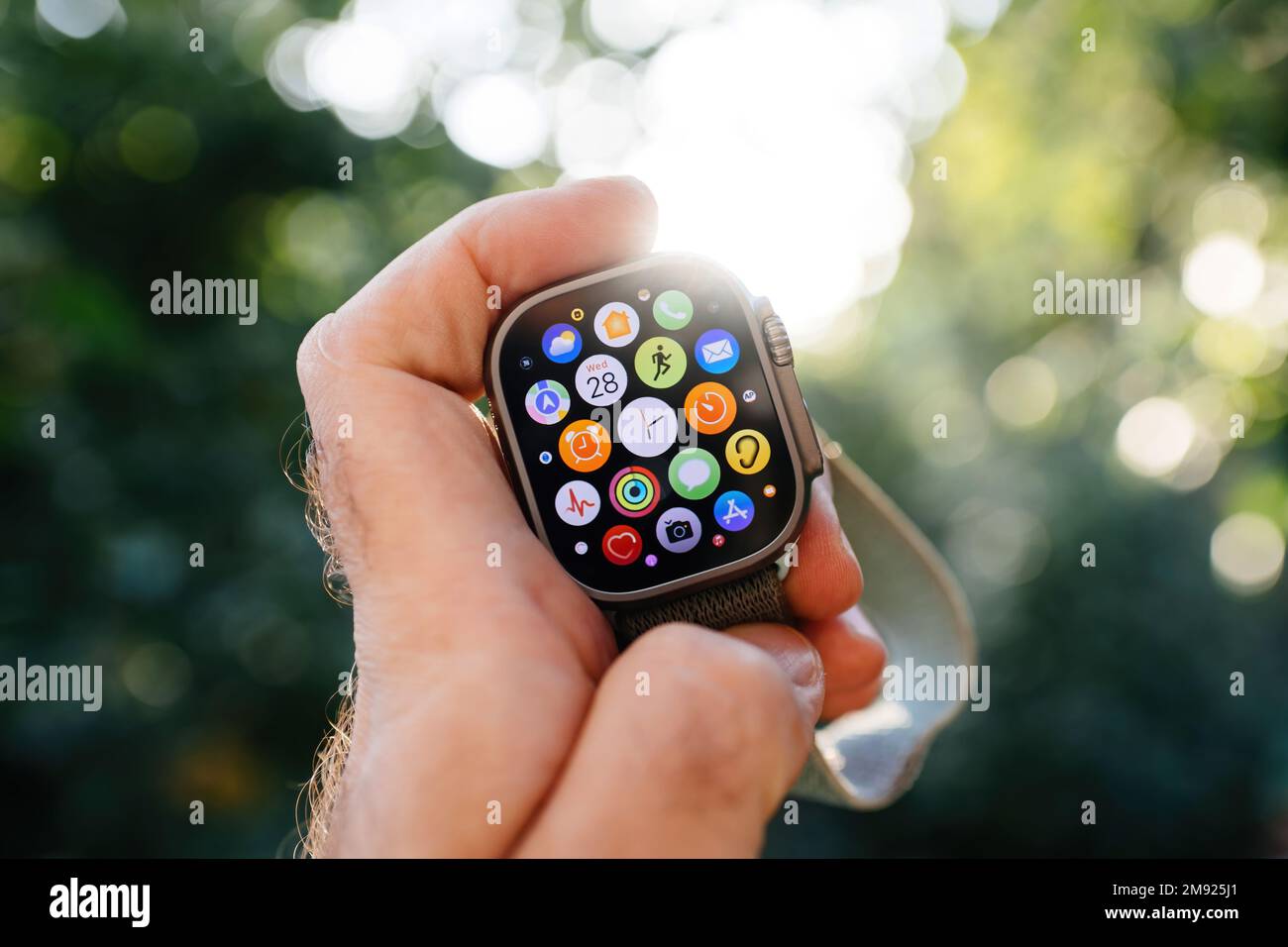 London, United Kingdom - Sept 28, 2022: Male hand holding new Apple Watch Ultra Smartwatch ...