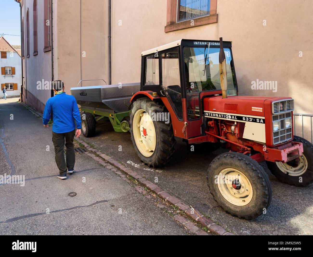 France - Sep 22, 2022: Rear view of farmer male walking near ...