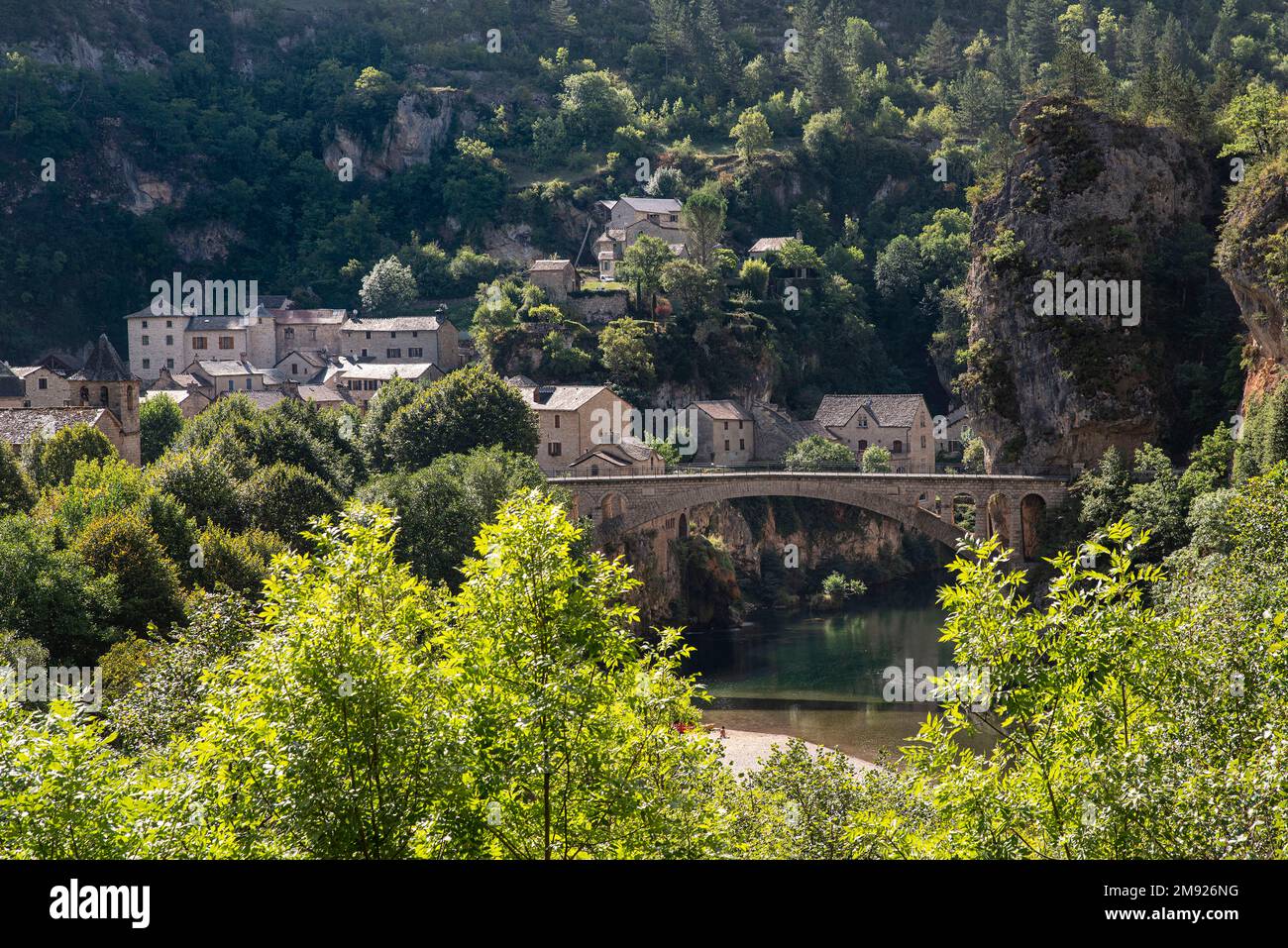 Village of Saint Chély du Tarn with its bridge in the Tarn Gorges in ...