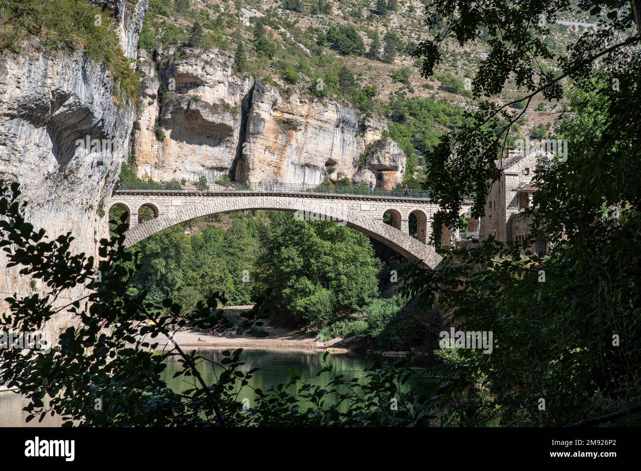 Village of Saint Chély du Tarn with its bridge in the Tarn Gorges in ...