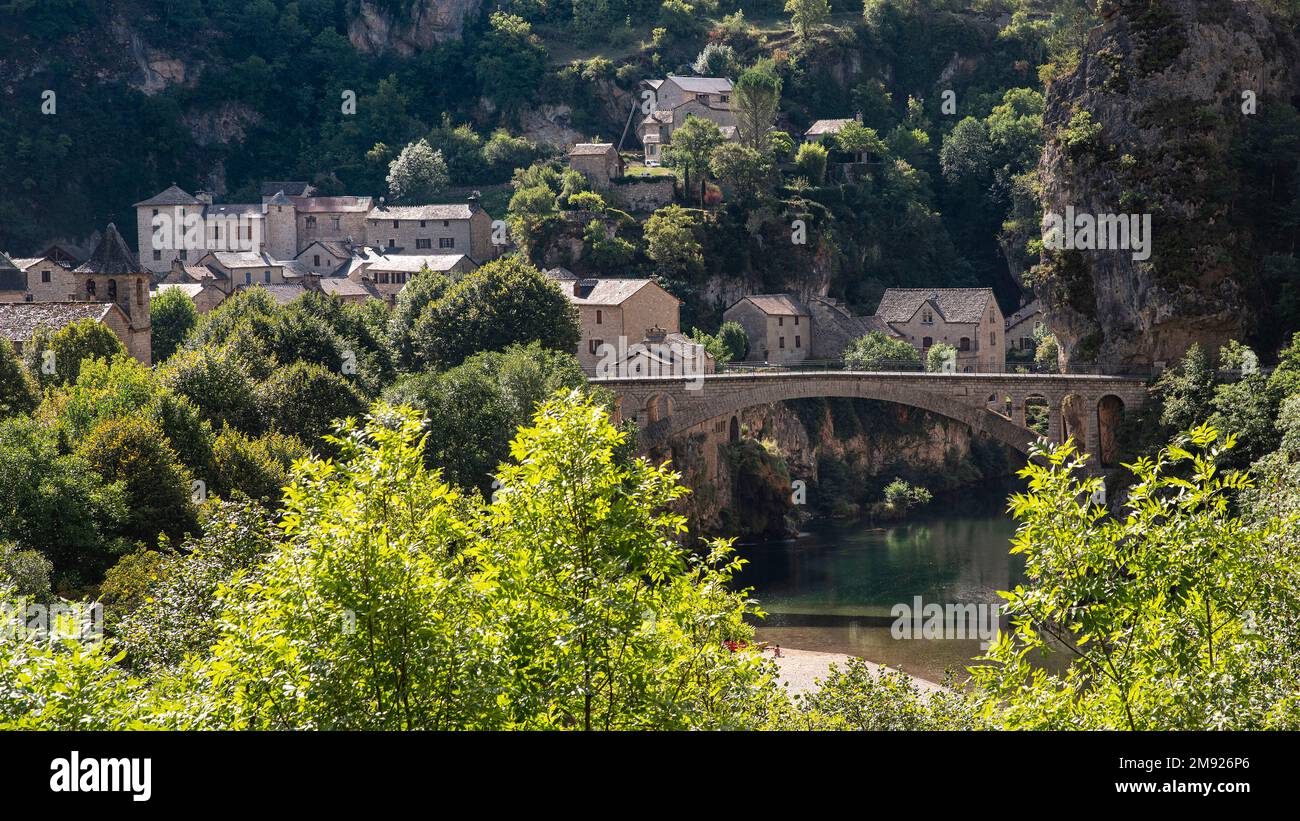 Village of Saint Chély du Tarn with its bridge in the Tarn Gorges in ...