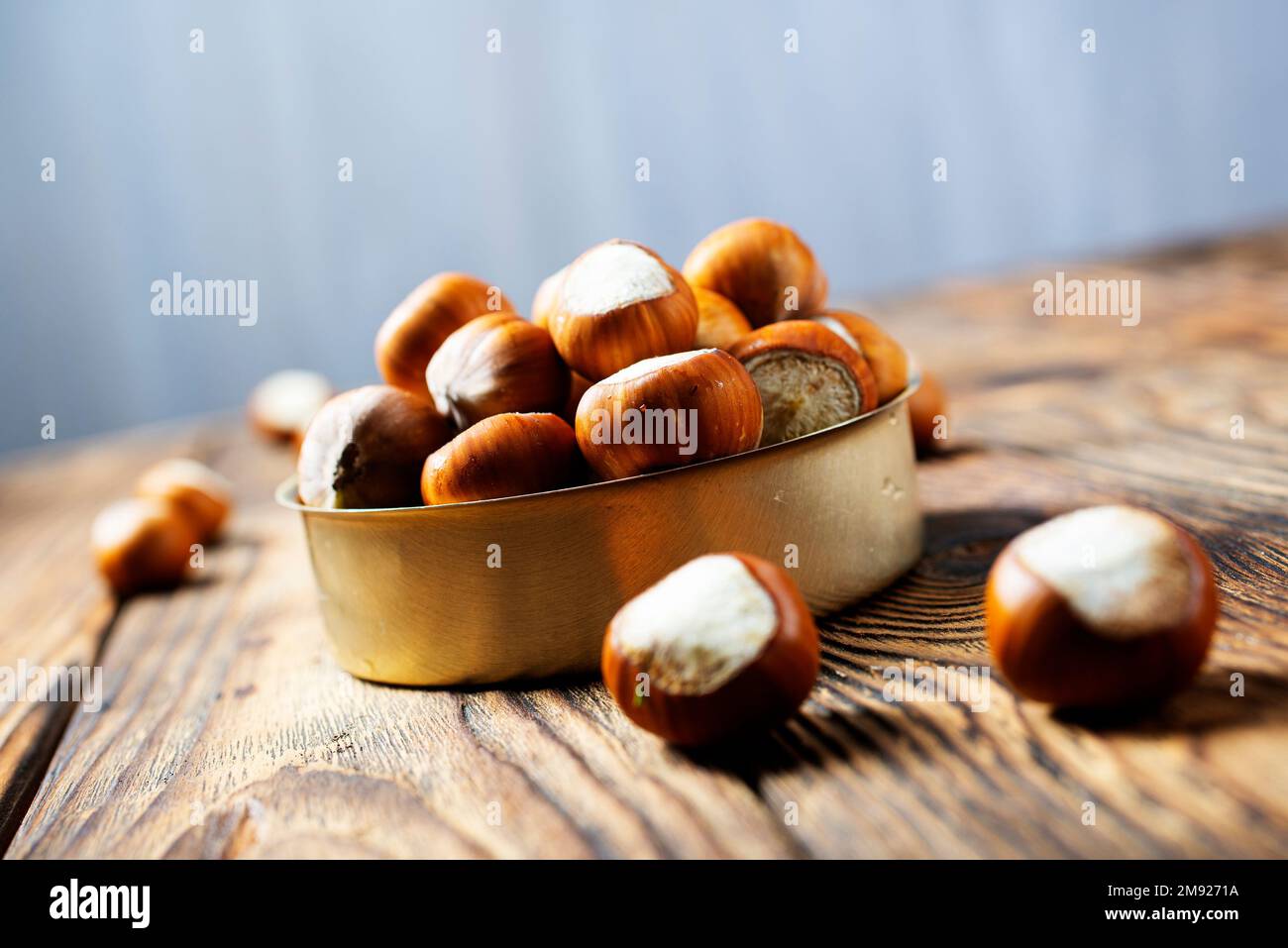 Hazelnuts on wooden backdrop. heap or stack of hazelnuts. Hazelnut ...