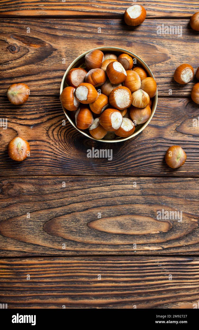 Hazelnuts on wooden backdrop. heap or stack of hazelnuts. Hazelnut ...