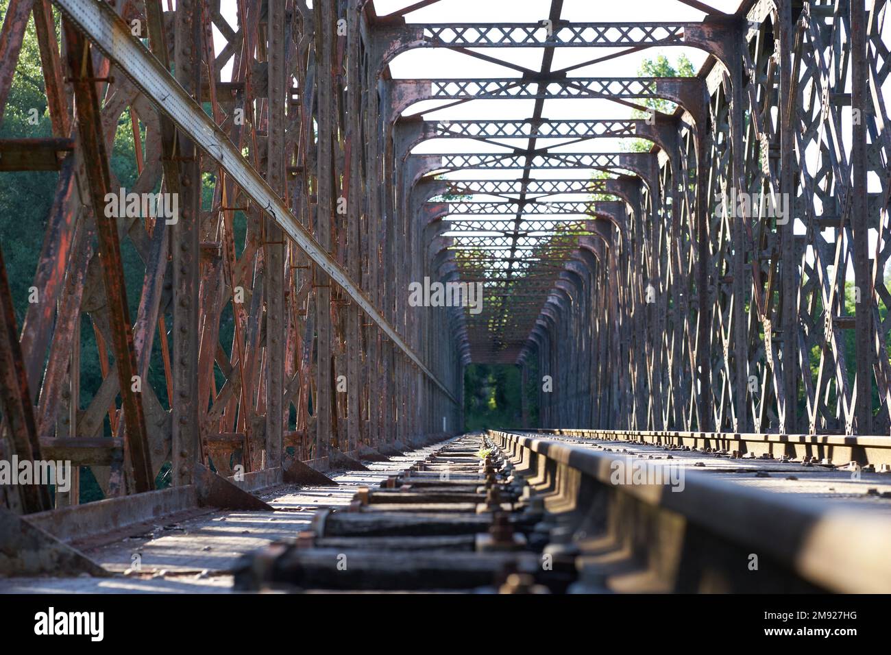 Wrought iron derelict railway bridge Stock Photo - Alamy
