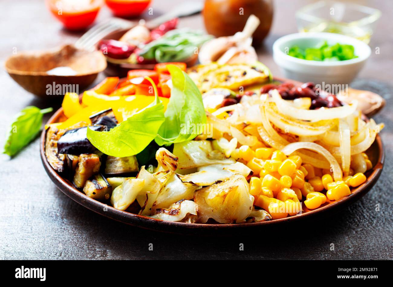 fried mix vegetables on dark plate Stock Photo - Alamy