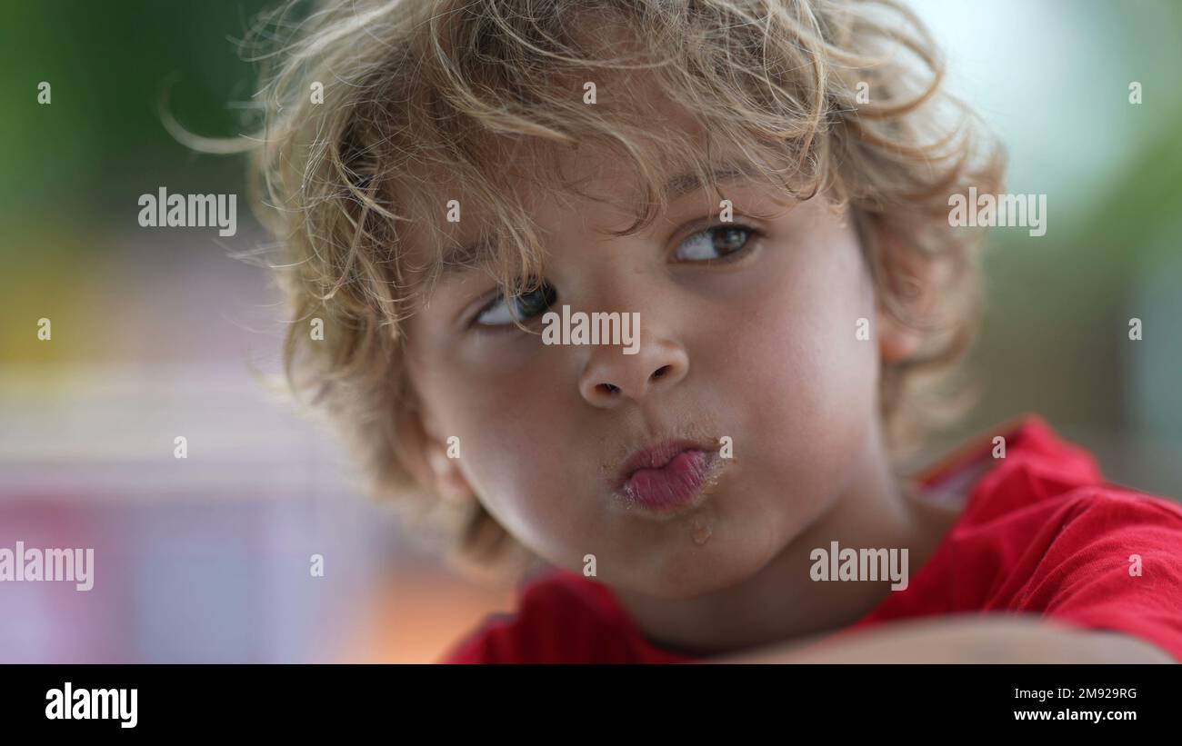 Bored little boy with nothing to do, child deep sigh Stock Photo - Alamy