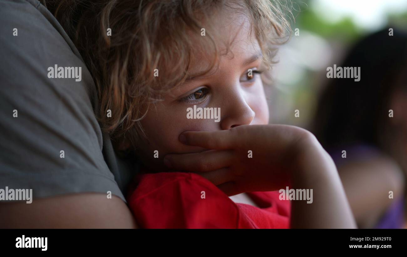 Bored pensive little boy on father lap. thoughtful child waiting Stock ...
