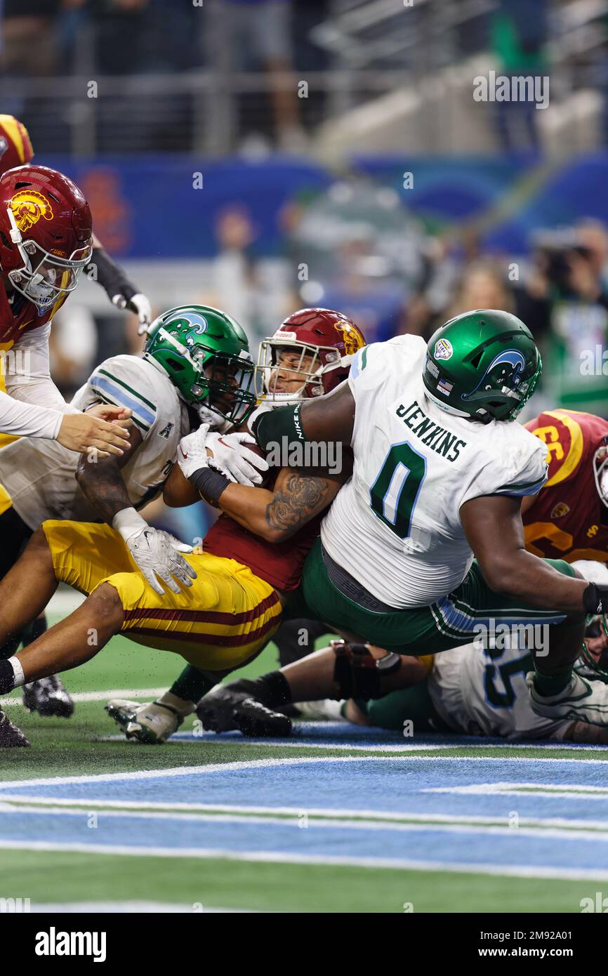 Tulane Green Wave defensive lineman Patrick Jenkins (0) bust through ...
