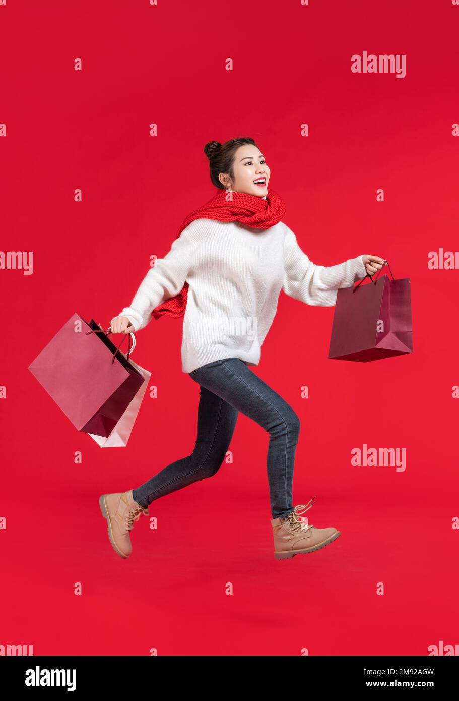 Happy young lady shopping Stock Photo - Alamy