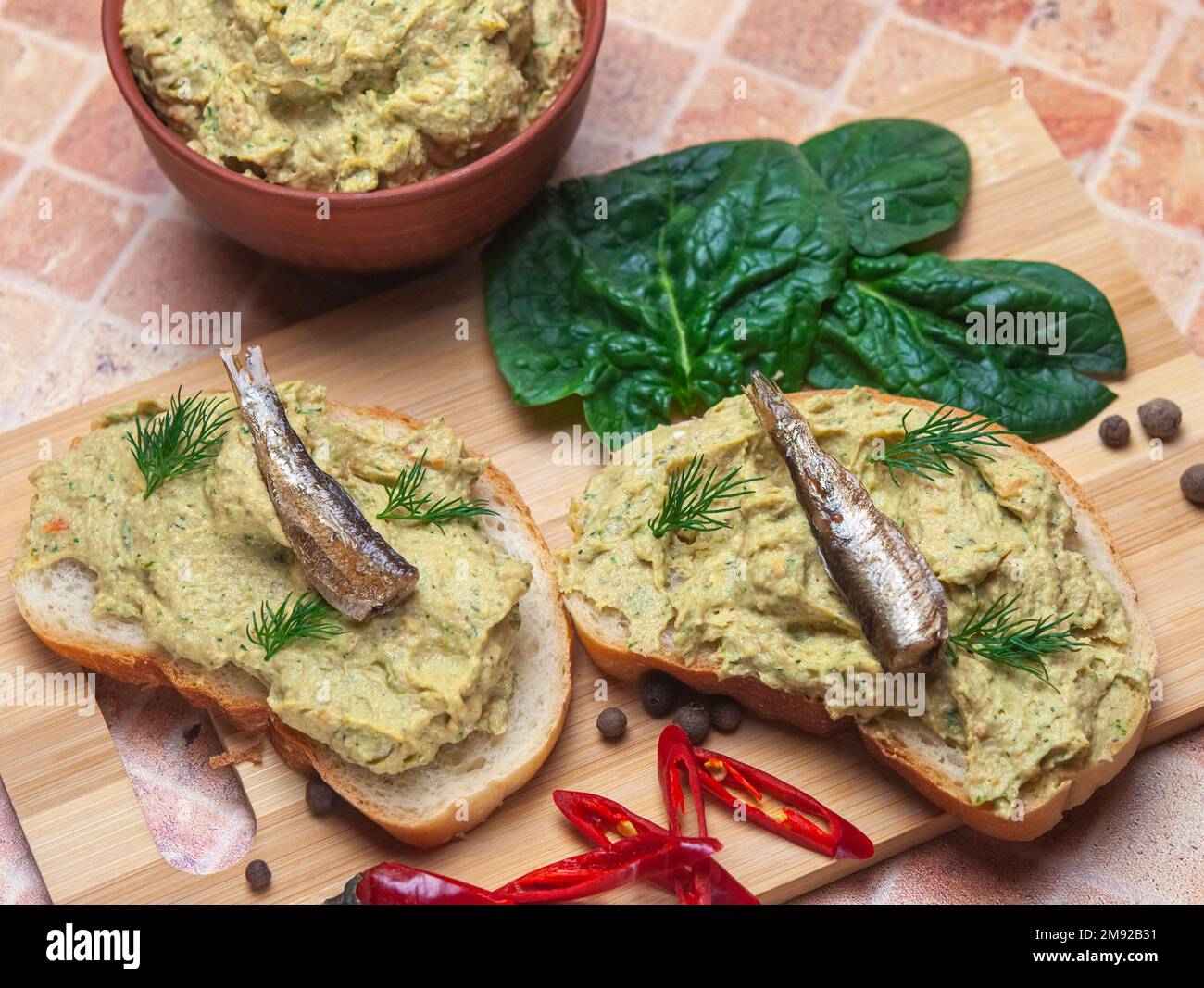 Sandwich with pate and sprats. Sprat pate with spinach and pepper ...