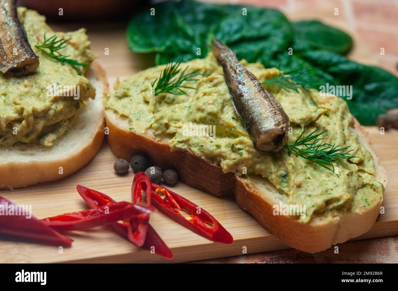 Sandwich with pate and sprats. Sprat pate with spinach and pepper ...