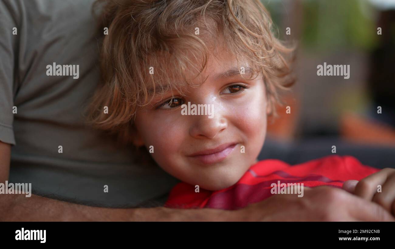 Child sitting on father lap, handsome kid boy Stock Photo - Alamy