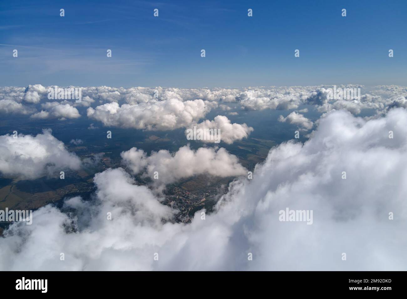 Aerial view from airplane window at high altitude of earth covered with ...
