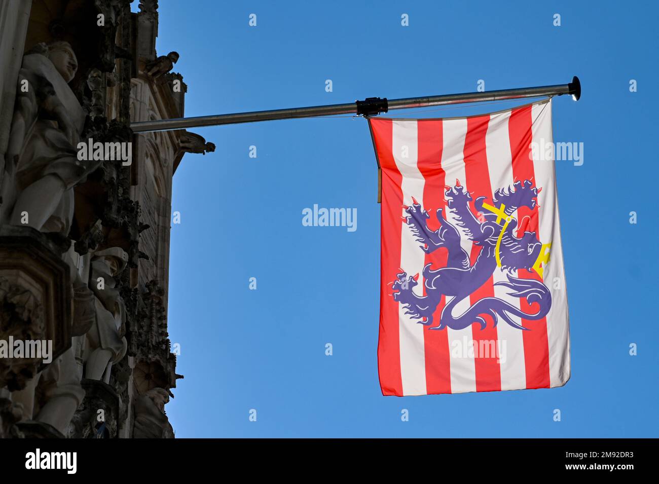 Bruges, Belgium - August 2022: Flag with coat of arms flying outside a ...