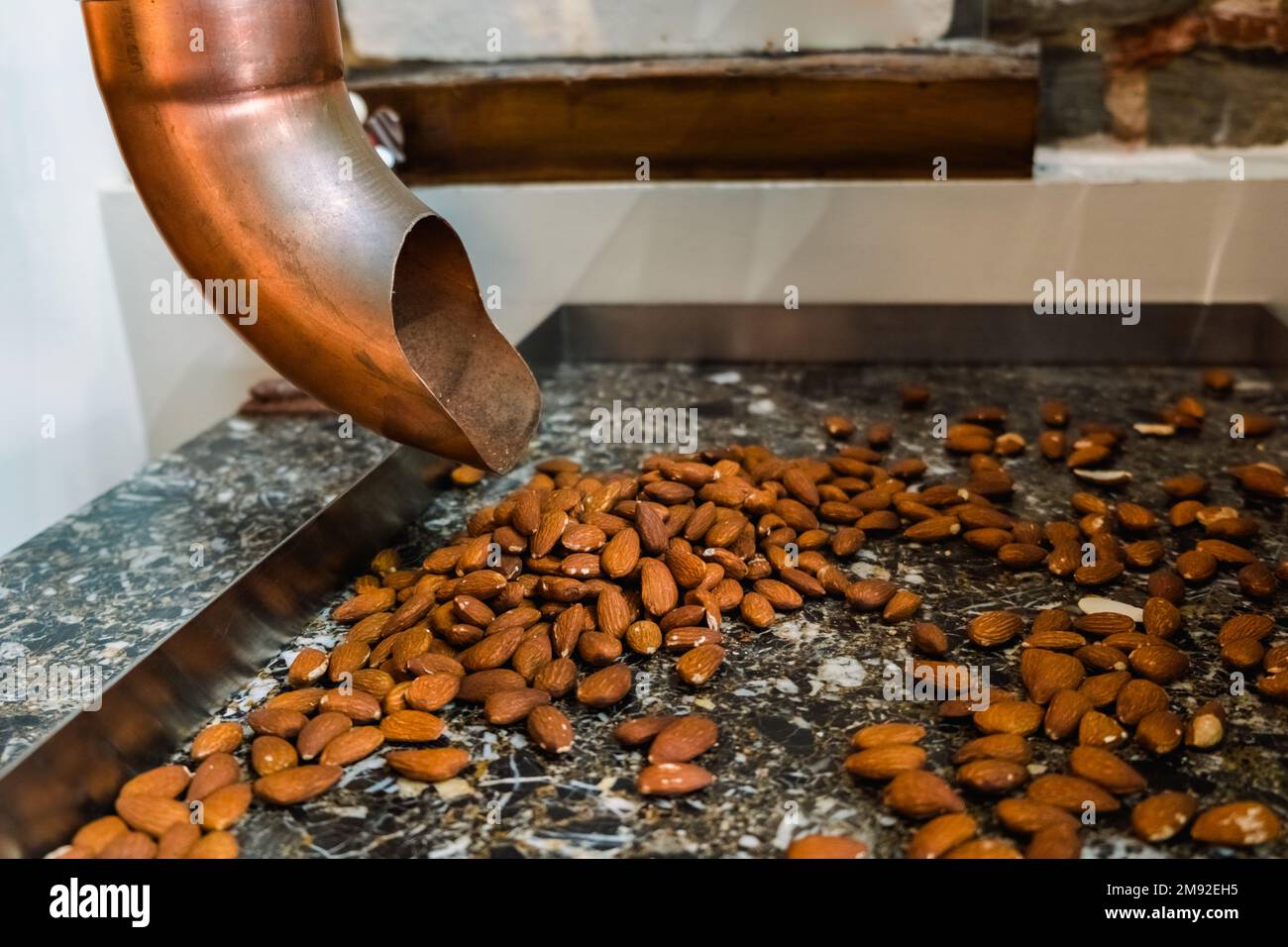 Toasted almonds with their skin by a pastry chef Stock Photo - Alamy