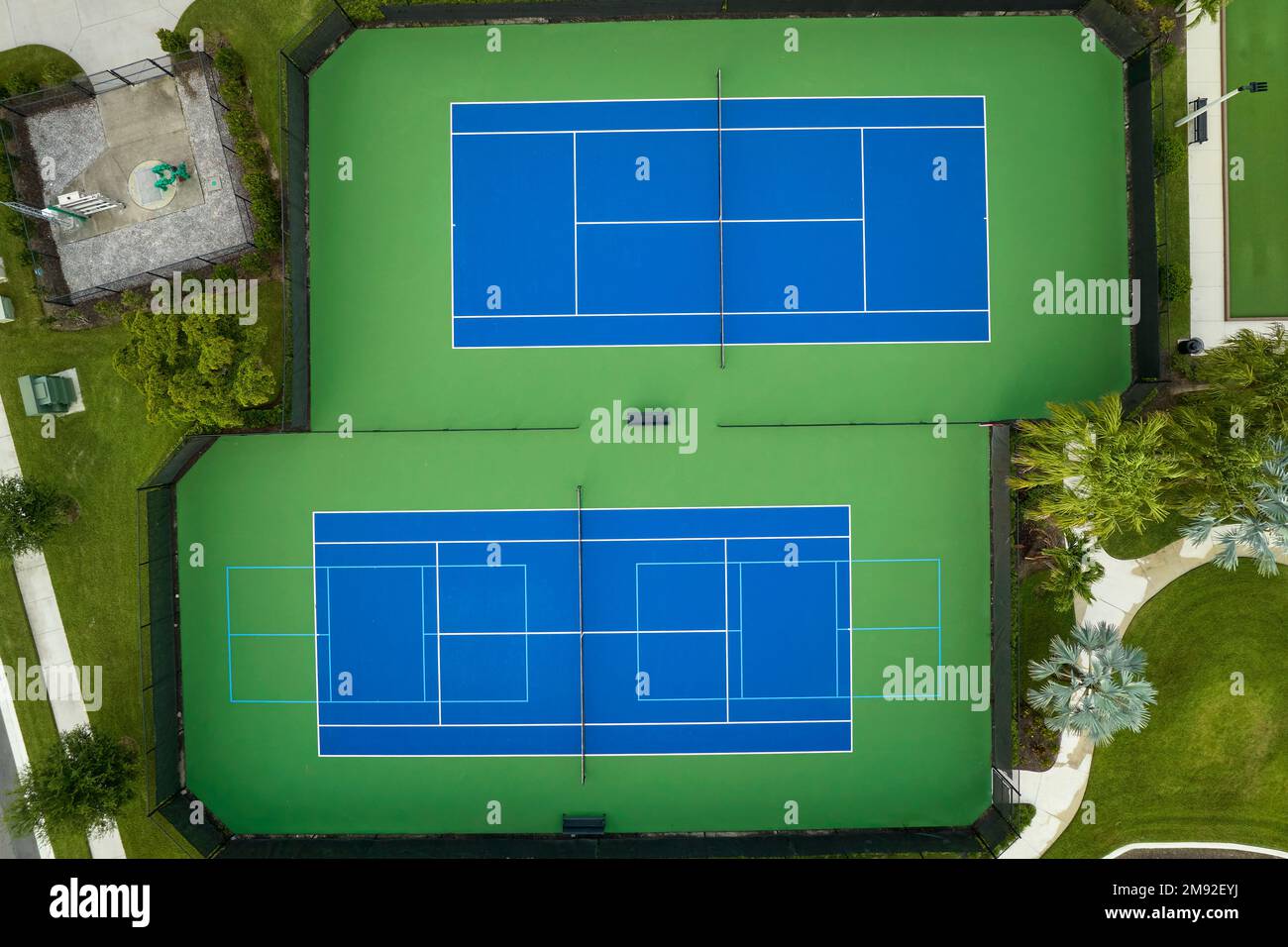 Aerial view of blue tennis courts for sports recreational activity ...